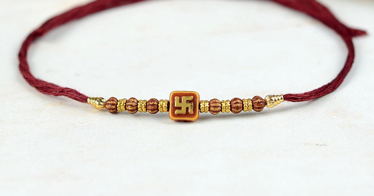 Maroon 400 Om and Swastik Rakhi | Divine Rakhi