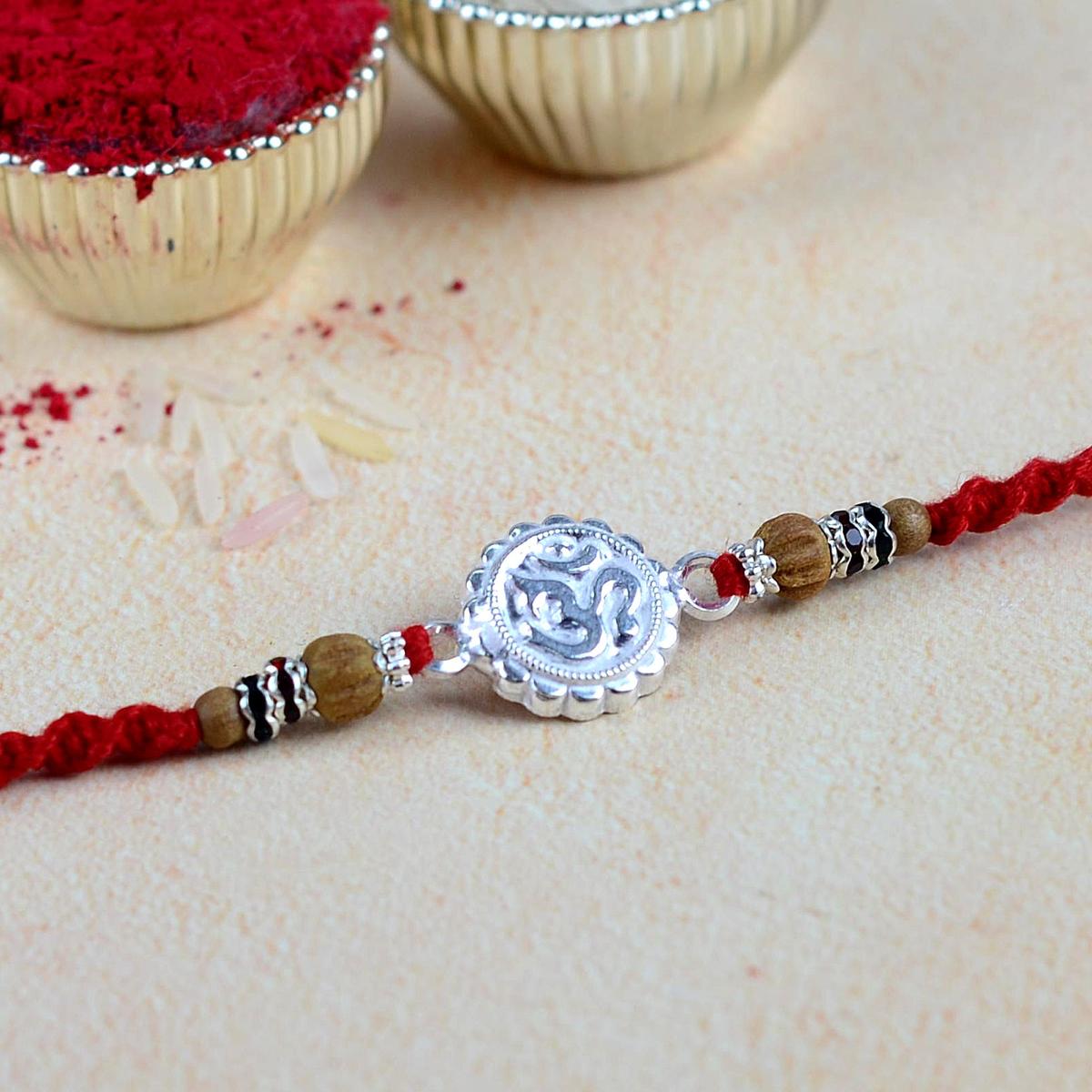 Real Silver Moulded Om Rakhi Red | Premium Rakhi