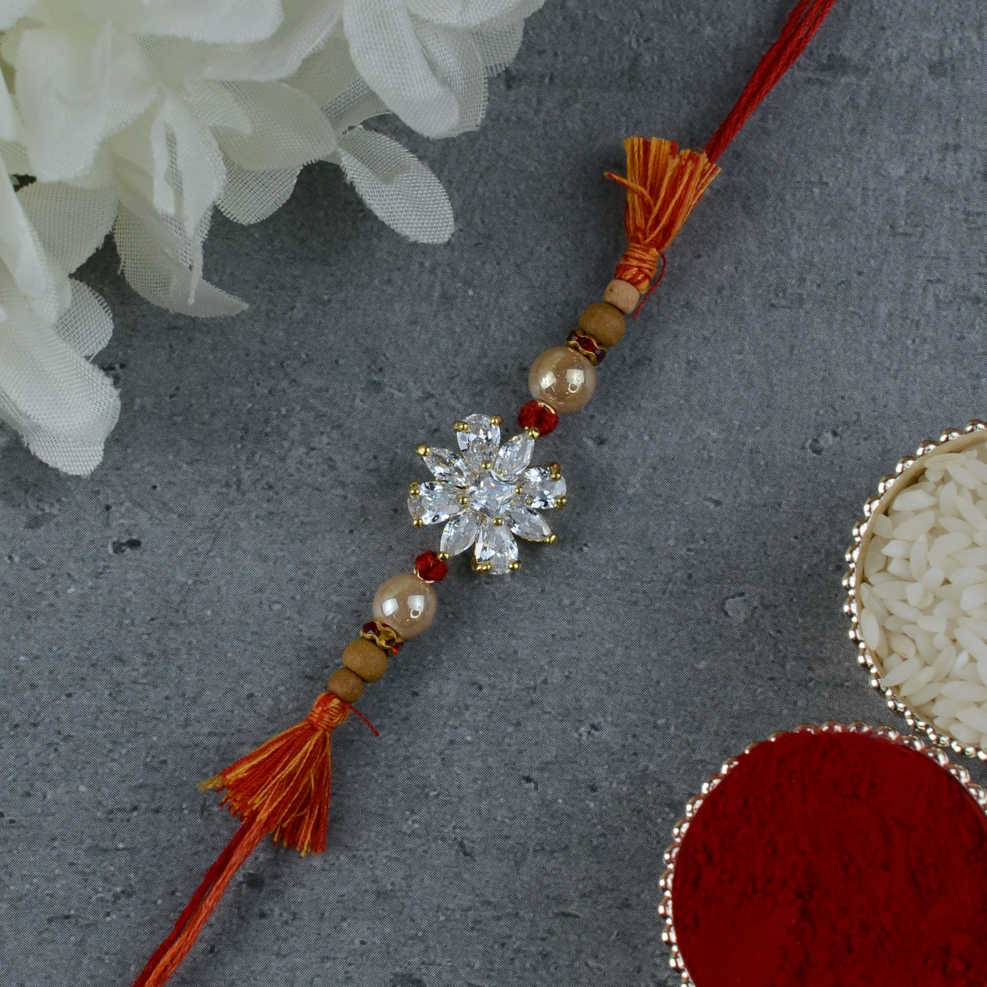 Glittering CZ Flower Rakhi | Stones Rakhi