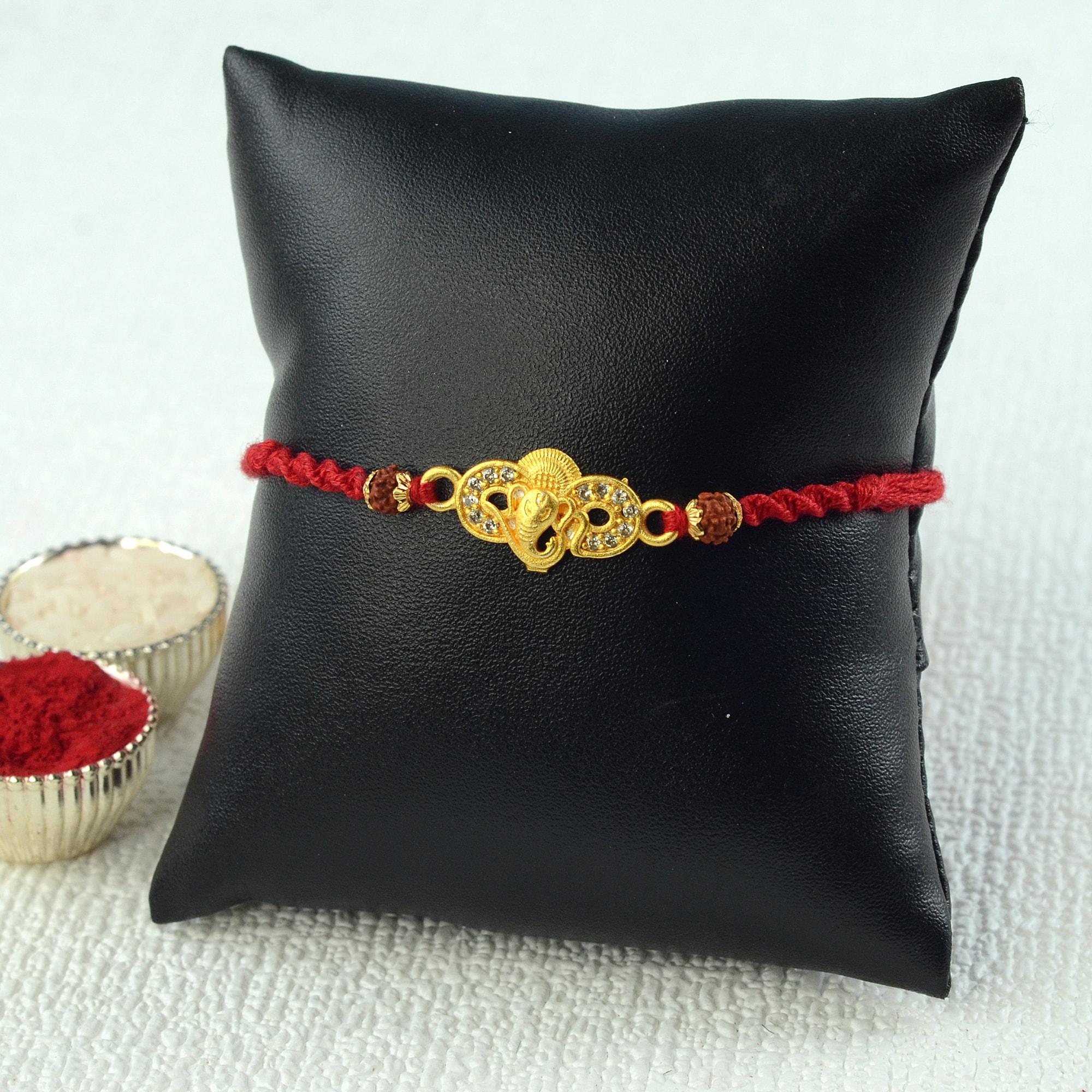 Mini Ganesh in Gold Rakhi | Ganesh Rakhis