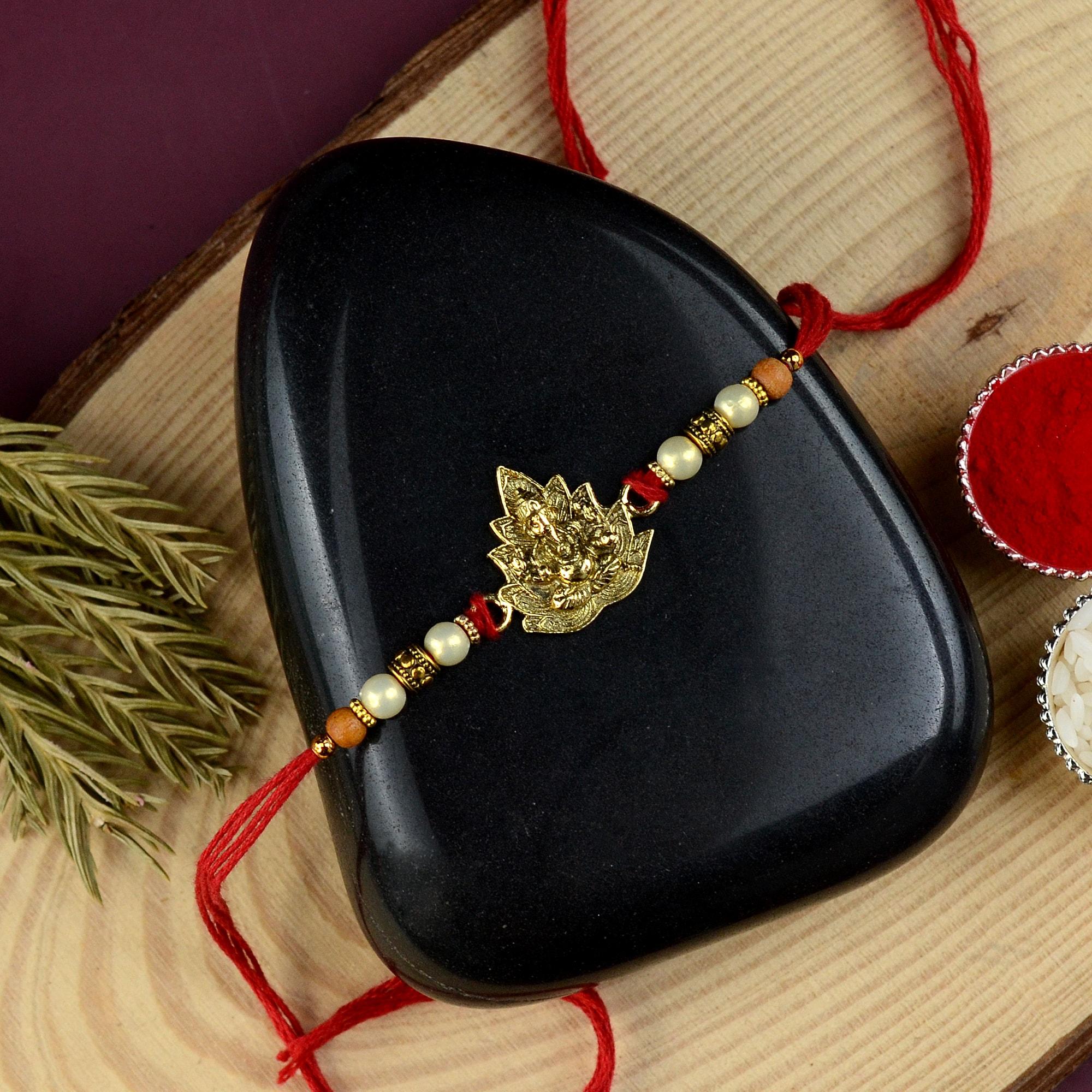 Golden Ganesh on a Leaf Rakhi | Ganesh Rakhis