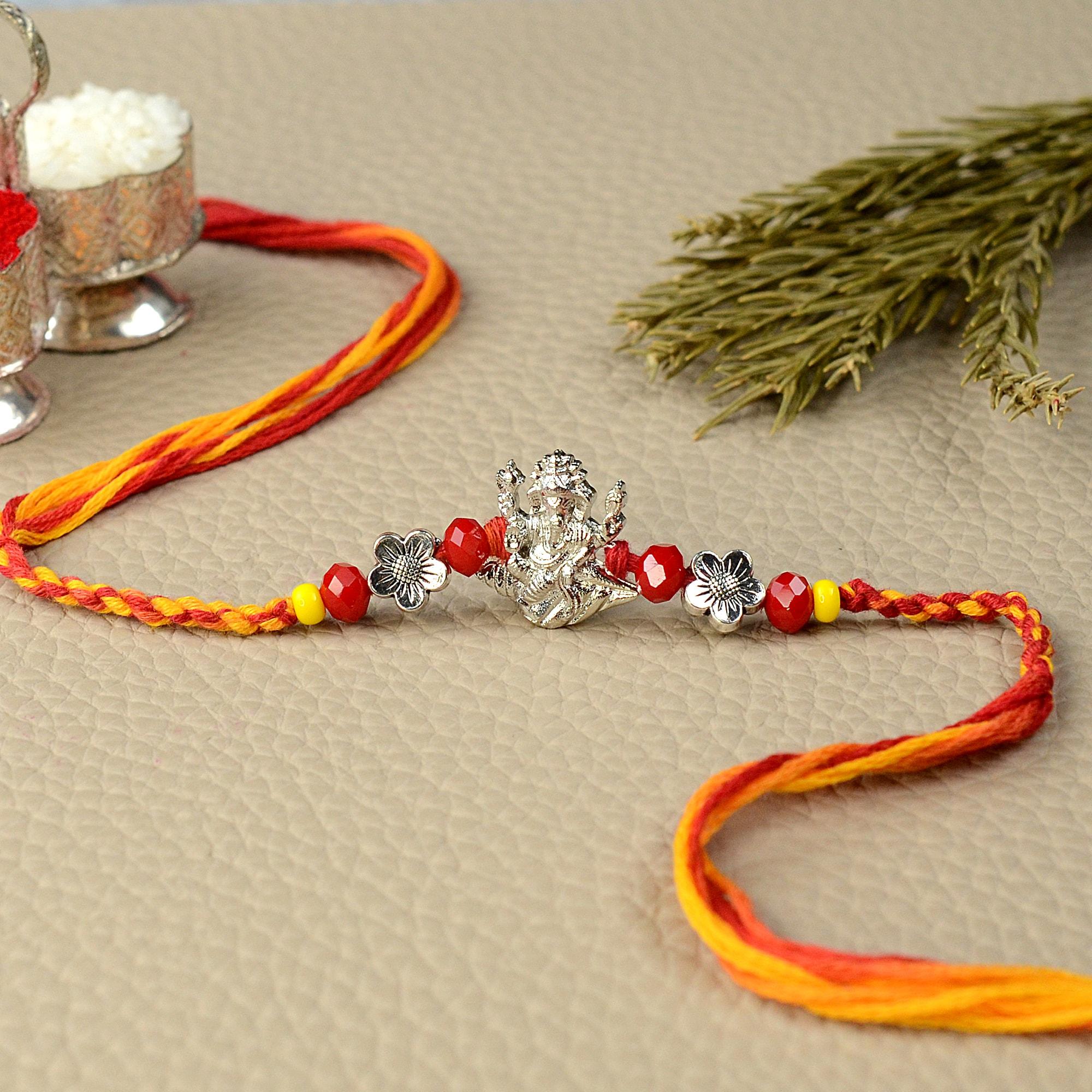 Glittering Ganesh on Conch Rakhi | Ganesh Rakhis