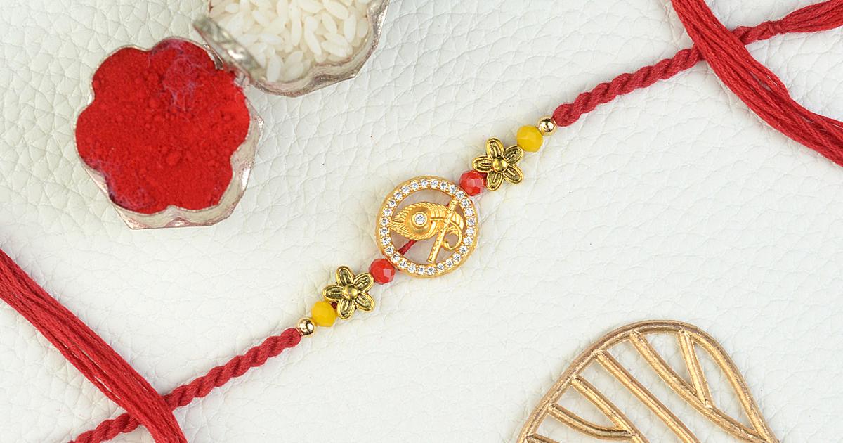 Krishna Symbols in Golden Ring Rakhi | Divine Rakhi